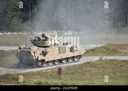 A Bradley Fighting Vehicle (BFV) crew of Charlie Company “Fighting Aces ...