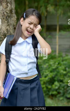 Crying Youthful Filipina Female Student With School Books Stock Photo ...