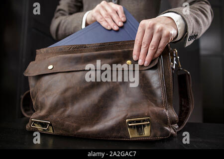 Teacher with a leather black briefcase in the village school Stock ...