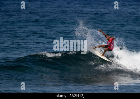 A surfer taking part in the Philippine National surfing Championships ...