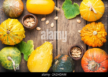 Autumn composition. Flat lay pumpkins, dry oak leaves, nuts, acorns on ...