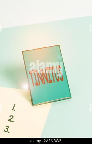 Writing note showing Tinnitus. Business photo showcasing A ringing or ...