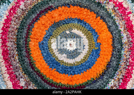 Old handicraft rug made from strips of cloth as background. Texture of ...