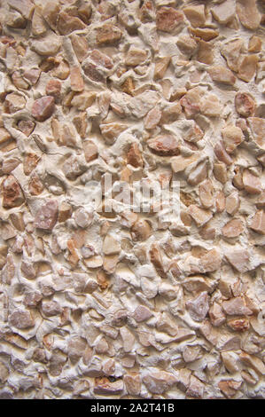 Close-up of a decorative wall surface made from irregular natural ...