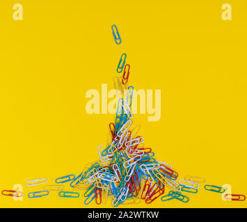 Colorful plastic paperclips isolated on white background, top view. Non ...