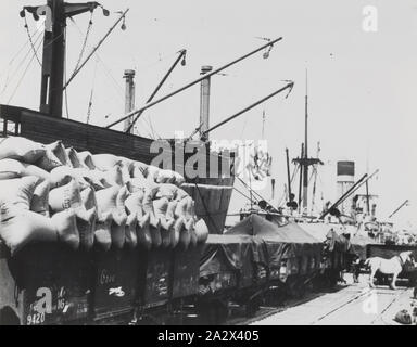 Black cargo ship loading in the port of Riga, Europe Stock Photo - Alamy