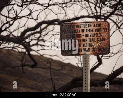 A burnt sign in a park from recent wildfire Stock Photo - Alamy