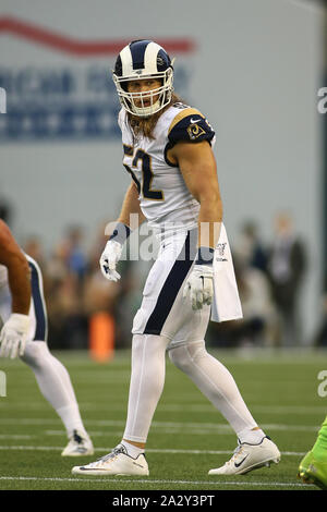 Los Angeles Rams linebacker Clay Matthews, left, runs ahead of center ...