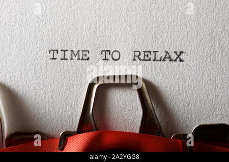 The sentence, Time to relax, written with a typewriter Stock Photo - Alamy