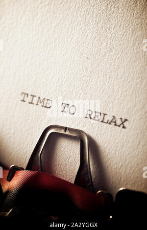 The sentence, Time to relax, written with a typewriter Stock Photo - Alamy