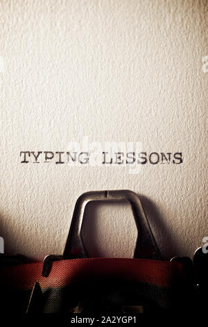 The sentence, Typing Lessons, written with a typewriter Stock Photo - Alamy