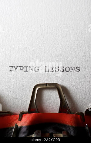 The sentence, Typing Lessons, written with a typewriter Stock Photo - Alamy