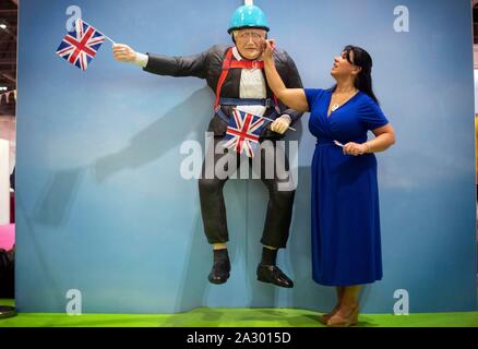 Cake maker Rosie Dummer makes the final touches to a life-sized Boris ...