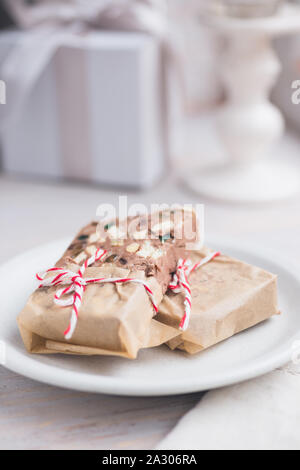 Milk chocolate bar with red bow on color wooden background Stock Photo ...