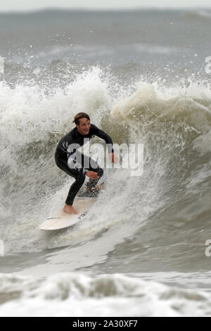 Welsh surfing champion and Wave Surf Coach, Emily Williams, (left ...