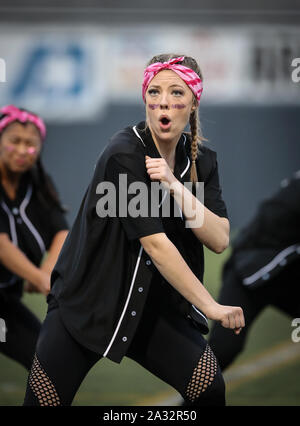 Cheerleaders and dancers from Rogers High School performing at half ...
