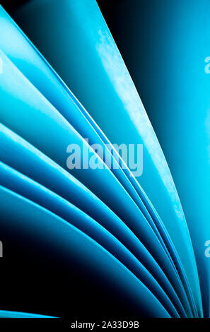 bright blue colored illuminated notepad in various position and ...