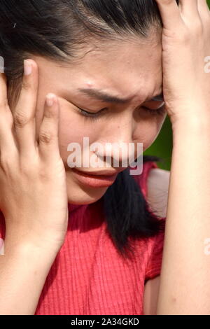 A Young Filipina Female Under Stress Stock Photo - Alamy