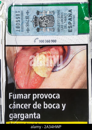 Healthcare warning written on a Spanish cigarettes pack Stock Photo - Alamy
