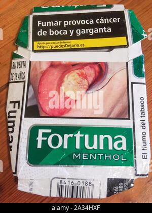 Healthcare warning written on a Spanish cigarettes pack Stock Photo - Alamy