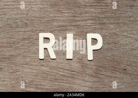 Alphabet letter in word RIP (abbreviation of rest in peace) on old red ...
