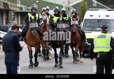 Mounted Police patrol around the ground during the Pre-season Friendly ...
