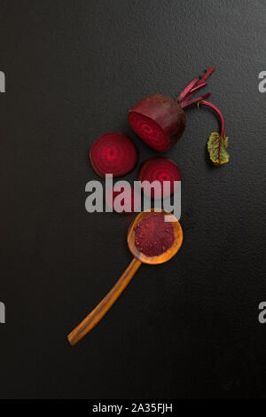 Wooden spoon with pile of purple salt for spa traetment Stock Photo - Alamy