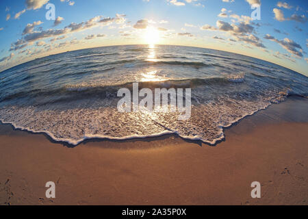 Fisheye view of sunrise over waves on Miami Beach, Florida Stock Photo ...