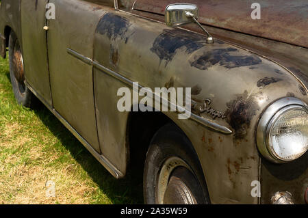 The front of a brown 1956 Singer Hunter on display at a car show Stock ...