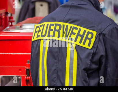 German firefighter in a action with a fire extinguisher Stock Photo - Alamy