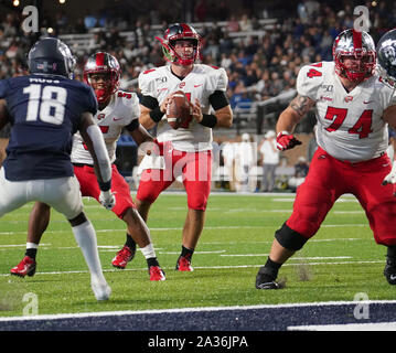 Western Kentucky quarterback Ty Storey (4) is hit by UAB defensive ...