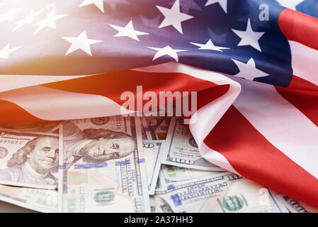 USA national flag and currency usd money banknotes on dark background ...