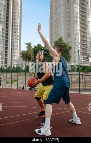 Two basketball players work out tactics outdoor Stock Photo - Alamy