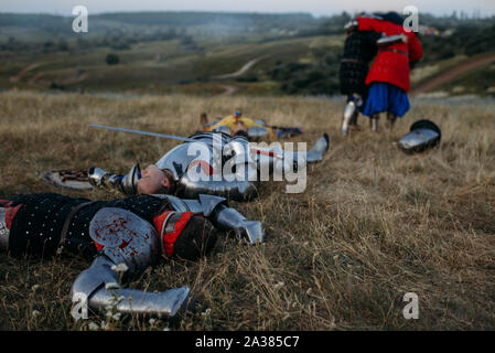 Wounded medieval knights after great battle Stock Photo - Alamy