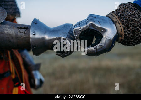 Medieval knights hands in metal gloves closeup view, great tournament ...