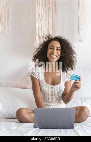 Positive delighted brunette woman using natural cosmetics Stock Photo ...