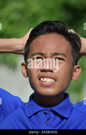 An A Forgetful Asian Boy Stock Photo - Alamy