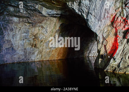 Types of a former underground marble quarry flooded with water. The ...