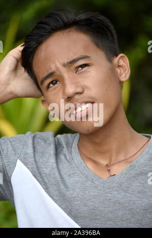 A Confused Young Filipino Teenage Male Stock Photo - Alamy