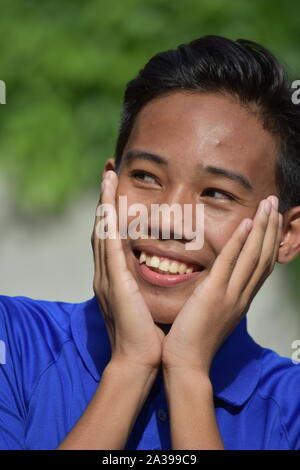 A Startled Asian Teen Boy Stock Photo - Alamy