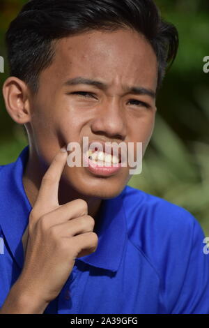 A Filipino Teenage Male With Toothache Stock Photo - Alamy