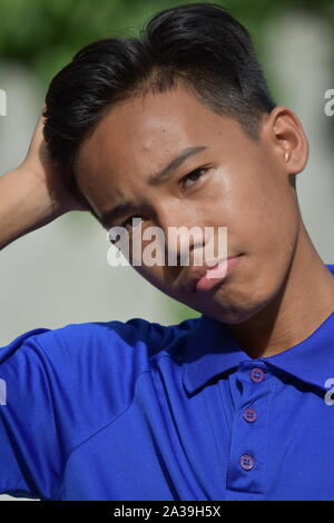 A Confused Young Filipino Teenage Male Stock Photo - Alamy