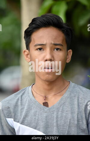 A Confused Young Filipino Teenage Male Stock Photo - Alamy