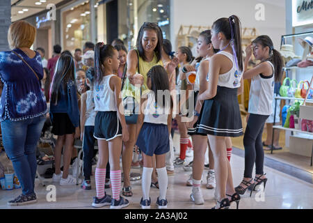 Model child. Young girls modeling on the catwalk runway participating ...