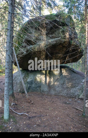 Kummakivi, balancing boulder on bedrock in Ruokolahti Finland Stock ...