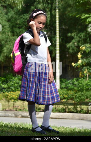 Unhappy Pretty Filipina Female Student With Books Stock Photo - Alamy