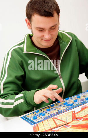 teenager playing bingo Stock Photo - Alamy