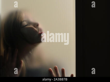 female face pressed against glass or window, funny female face ...