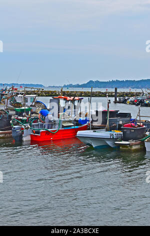 A view of Poole Harbour Haven marina with fishing goods such as nets ...