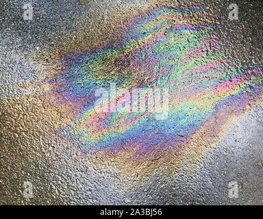 Oil spill pattern on asphalt Stock Photo - Alamy